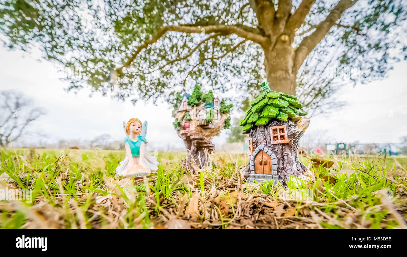Fairy princess dreams outside of woodland houses Stock Photo - Alamy