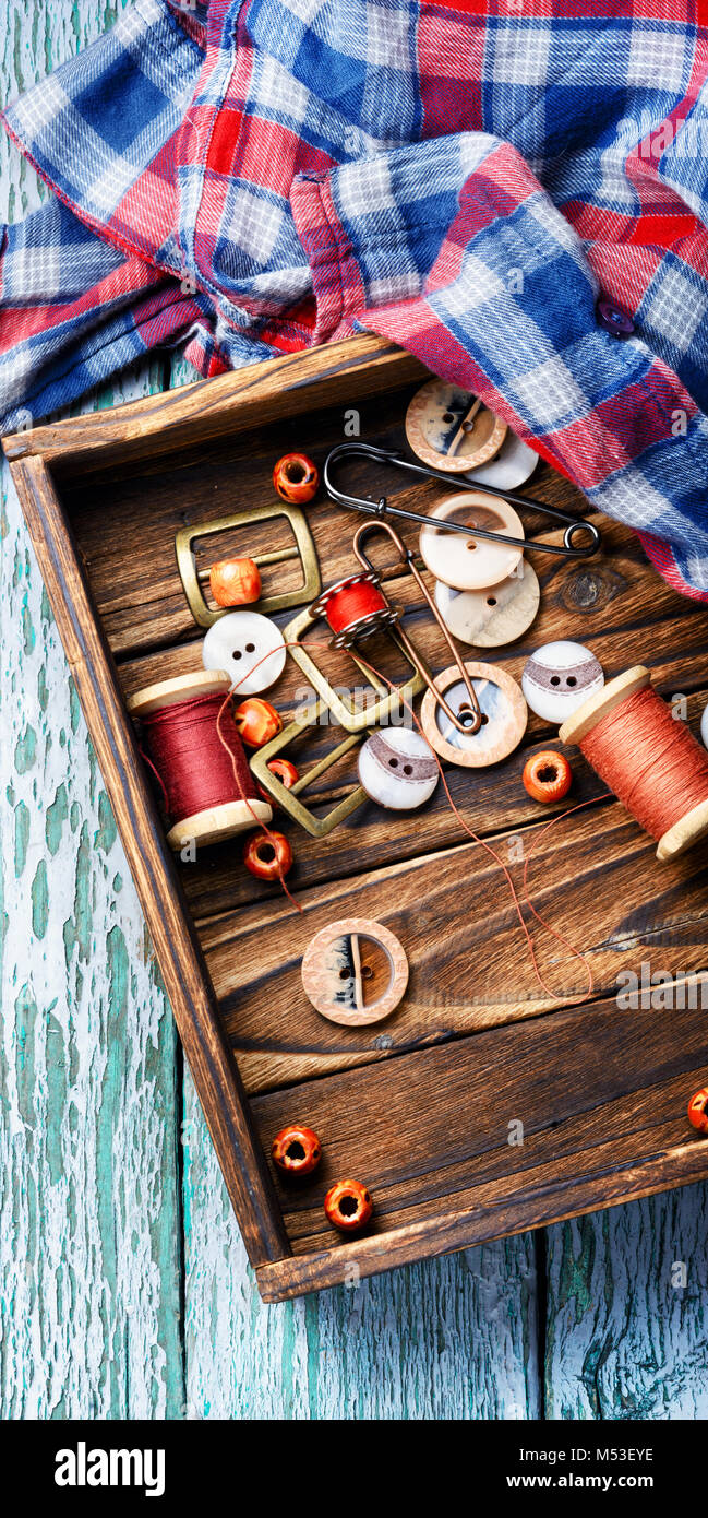 sewing kit from sewing thread, buttons and fabric Stock Photo - Alamy