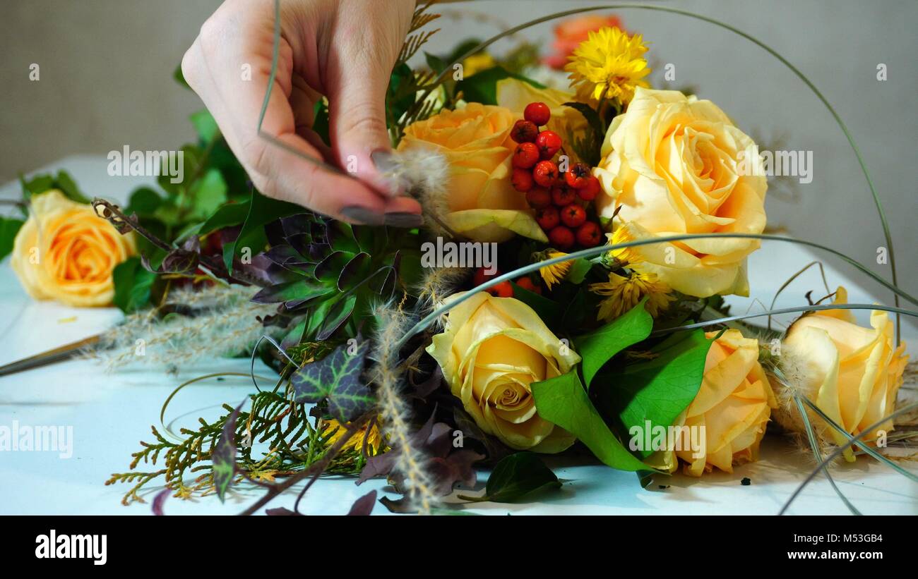 Close-up shot of process as female flower designer brings fini Stock ...