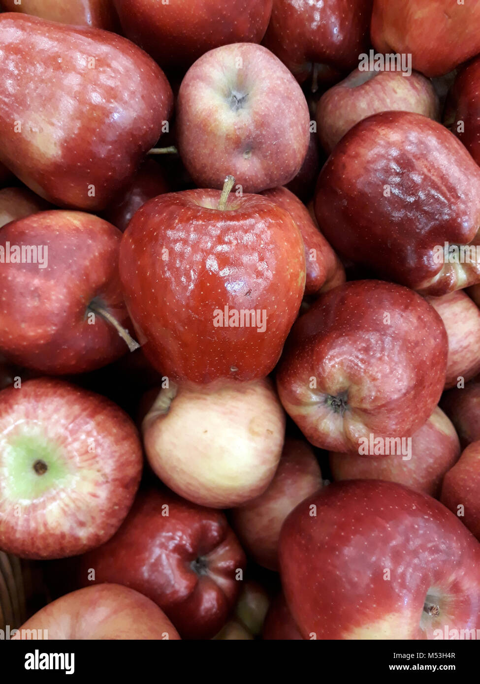Fresh red shiny apples on the counter, may be used as background Stock ...