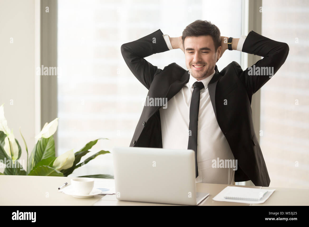 Relaxed employee enjoying result of good job done Stock Photo - Alamy