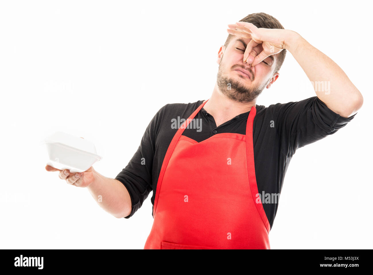 Male supermarket employer gesturing bad smelling lunch box isolated on ...