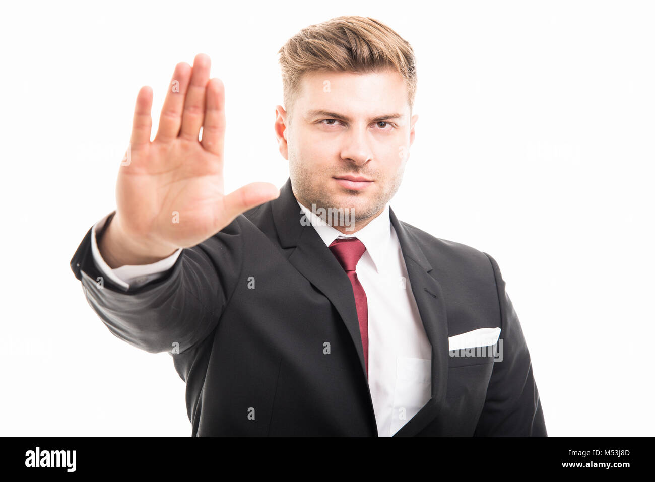 Portrait of handsome corporate business man showing stop gesture ...
