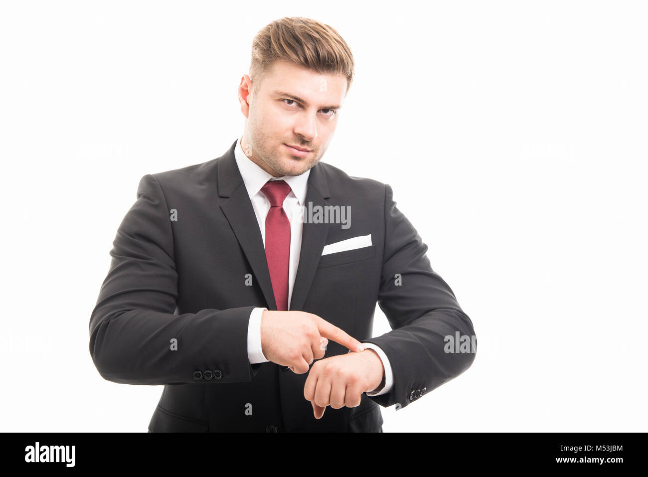 Handsome business man showing wrist watch like time out gesture ...