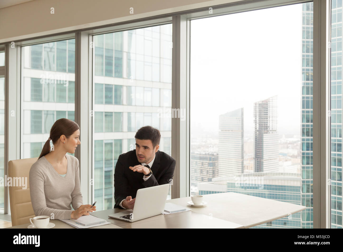 Female and male CEO discussing company strategy Stock Photo - Alamy