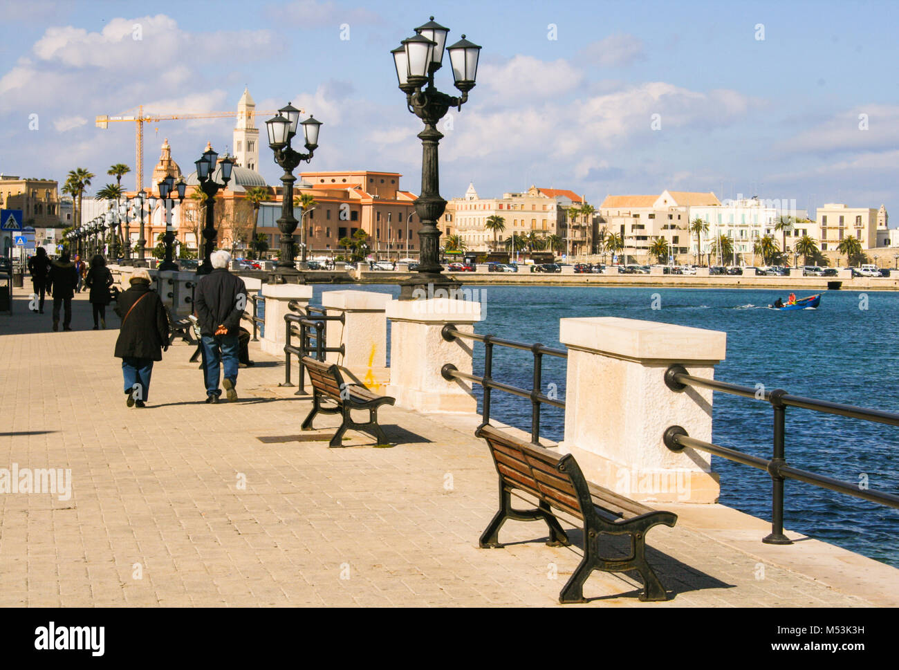 Seafront promenade with benches and old town in the background Stock ...