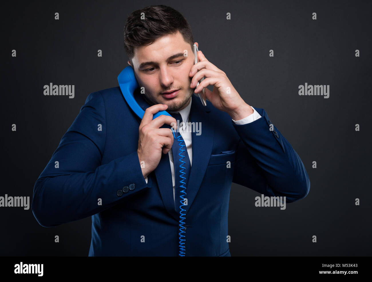 Two person speaking smart phone hi-res stock photography and images - Alamy