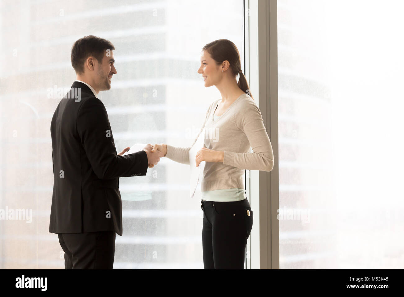 Female company secretary meeting client in office Stock Photo - Alamy