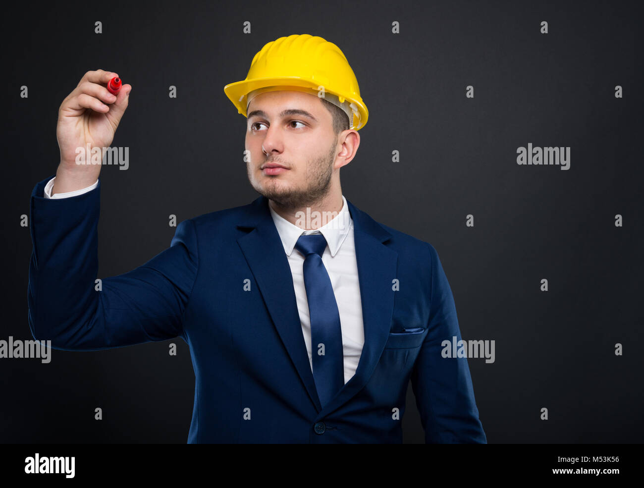Engineer man drawing with marker on blank screen with copy space on ...