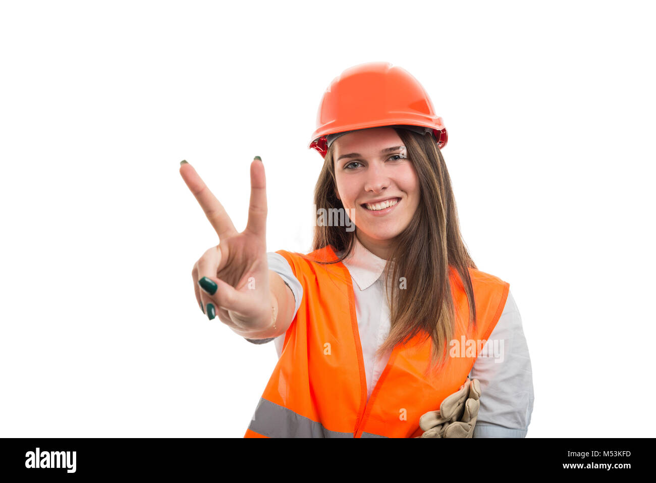 Female engineer happy showing peace or victory sign on white background ...