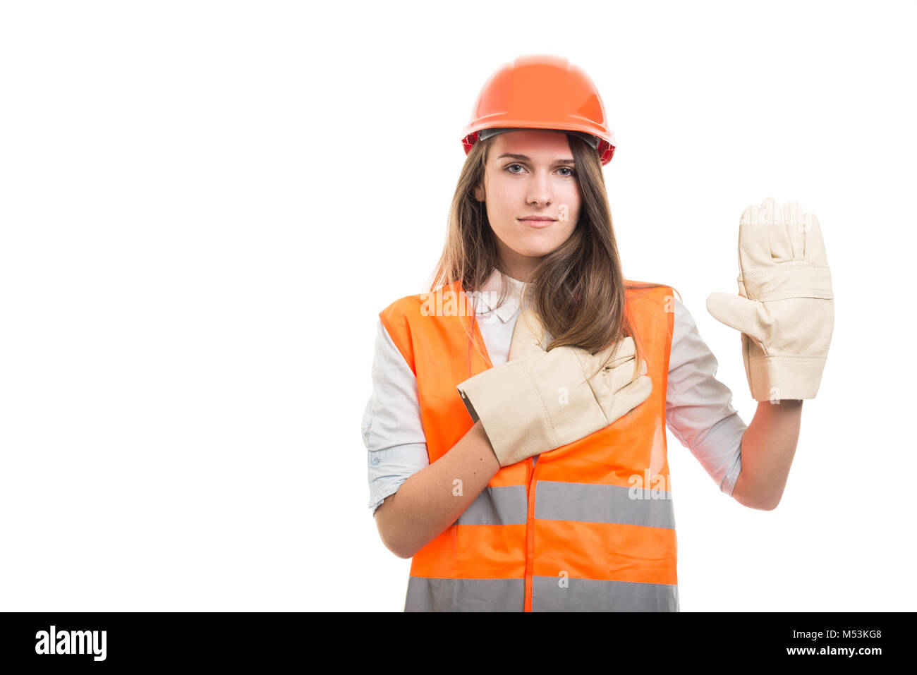 Beautiful female engineer making true oath with hand on heart as real ...