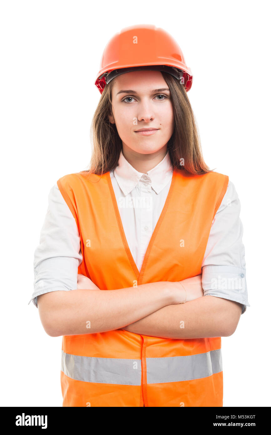 Smiling successful woman builder posing with crossed arms isolated on ...