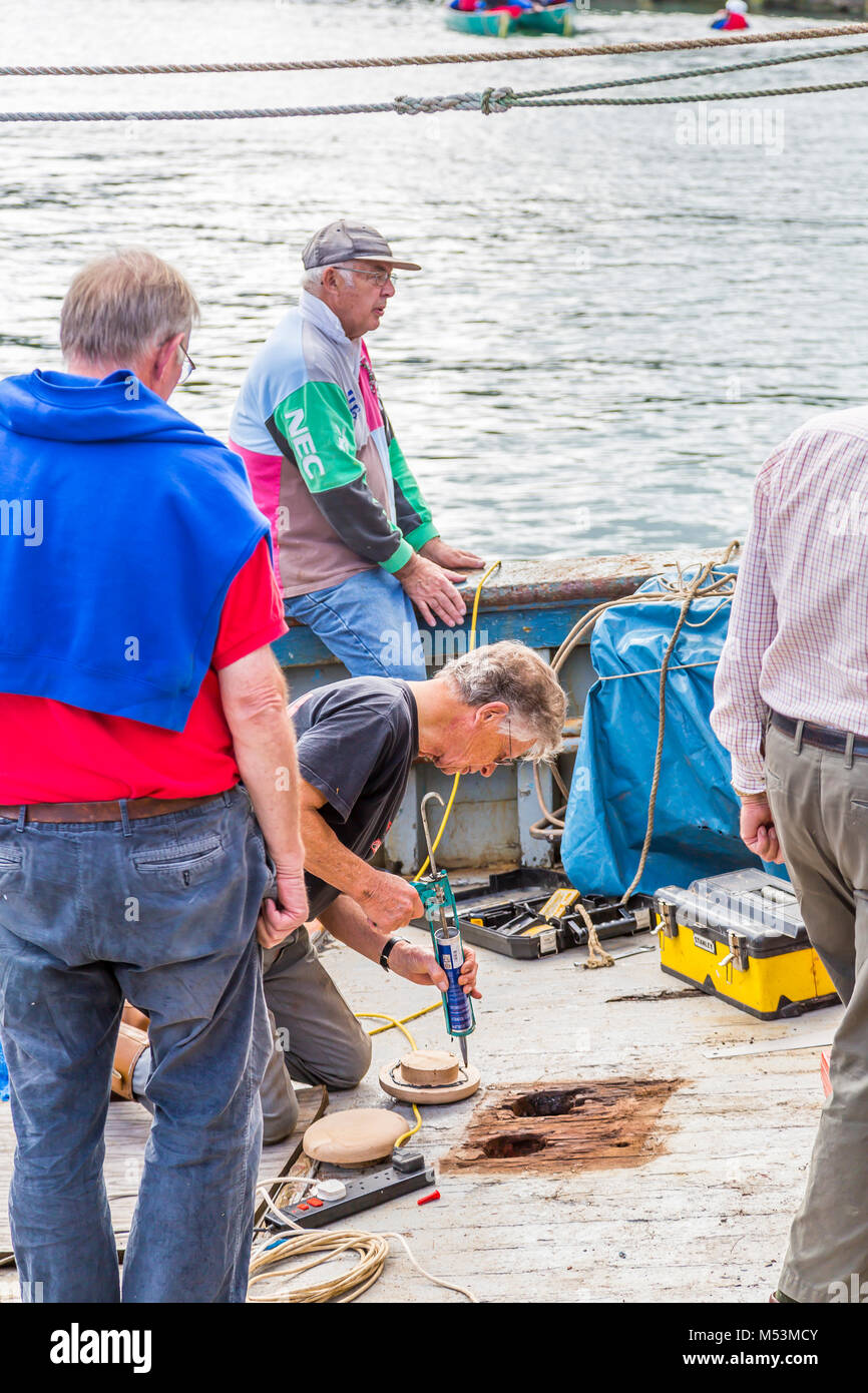 Essential maintenance on a boat while in harbour Stock Photo - Alamy