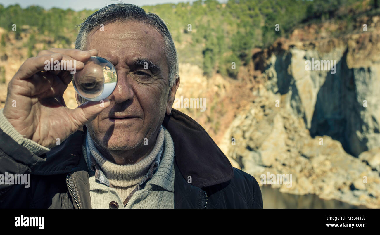Elderly man with crystal ball Stock Photo - Alamy