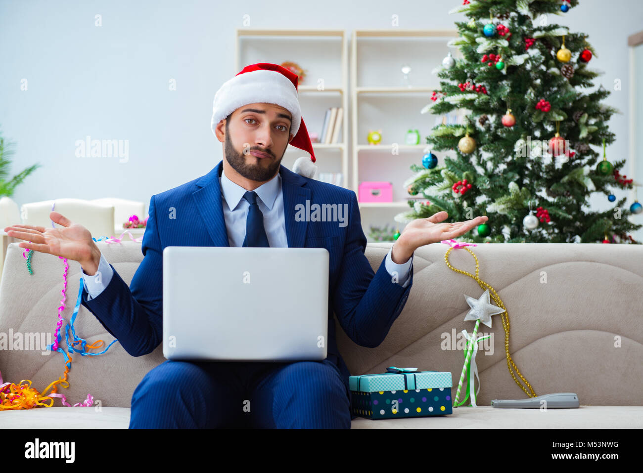 Businessman working at home during christmas Stock Photo - Alamy