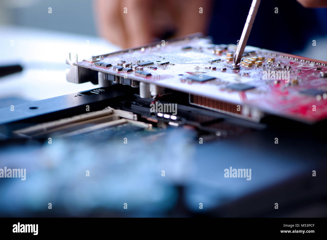 Repairman working in technical support fixing computer laptop tr Stock ...