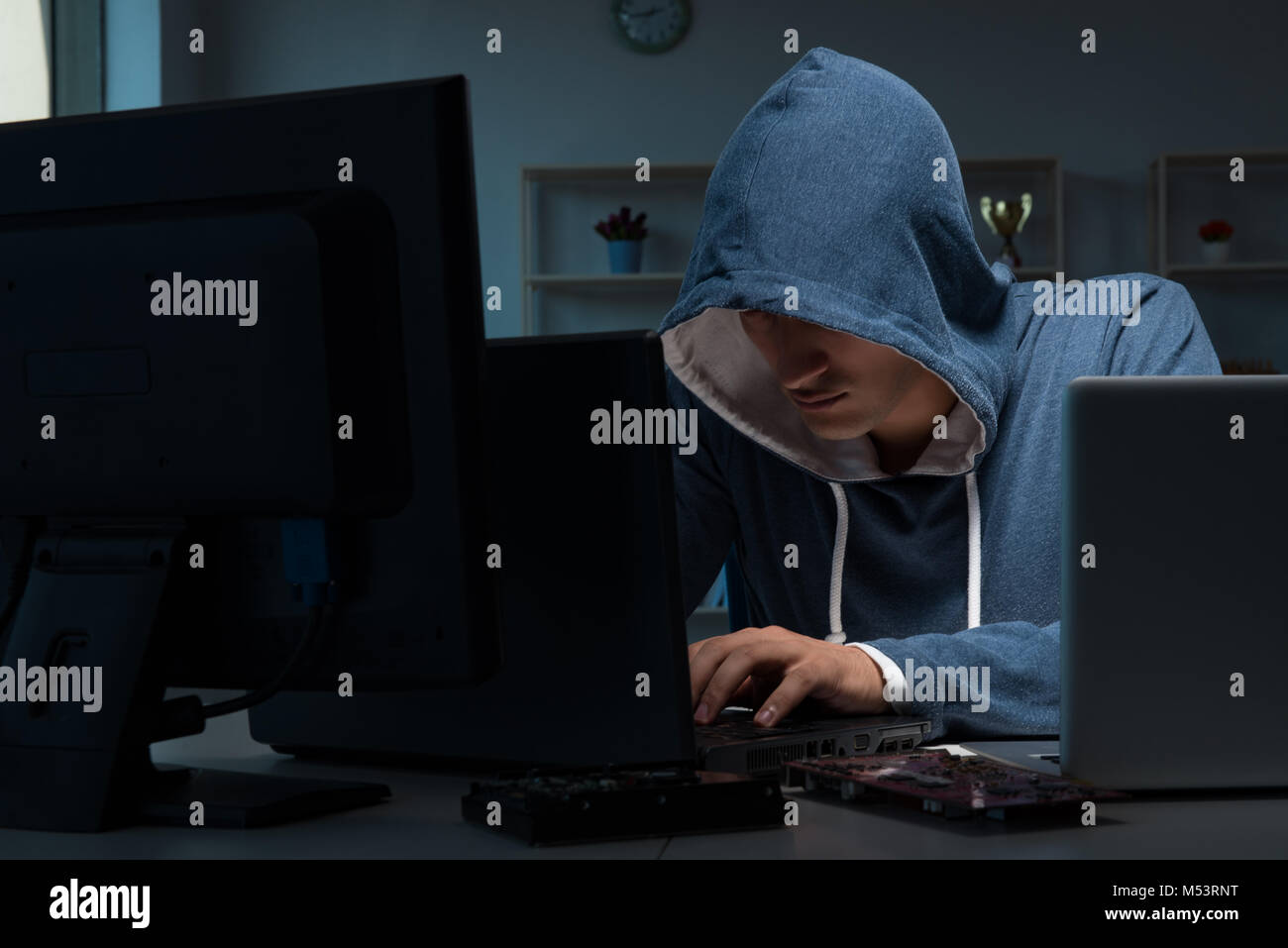 Hacker hacking computer at night Stock Photo - Alamy