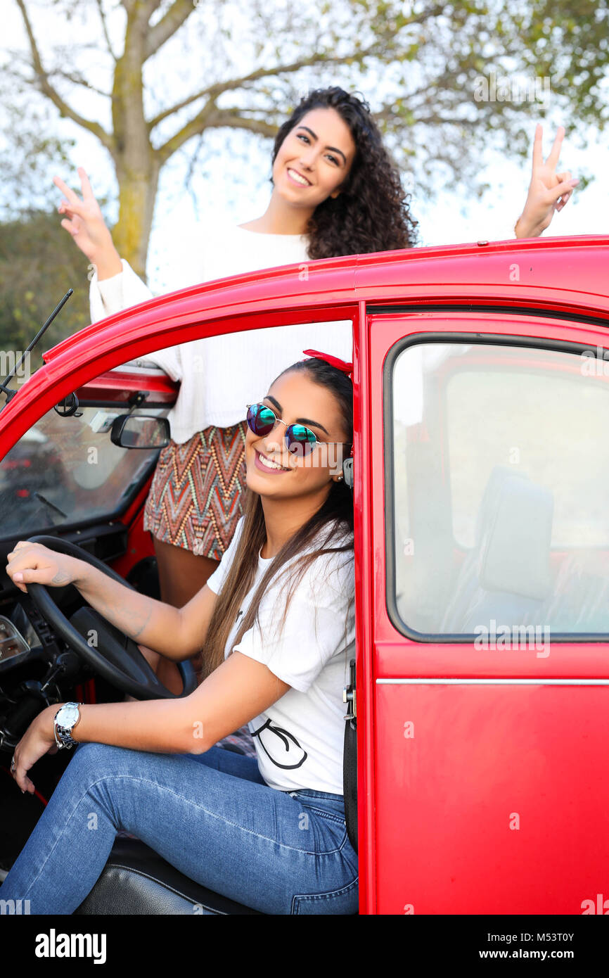 Two friends going on a roadtrip through countryside Stock Photo - Alamy