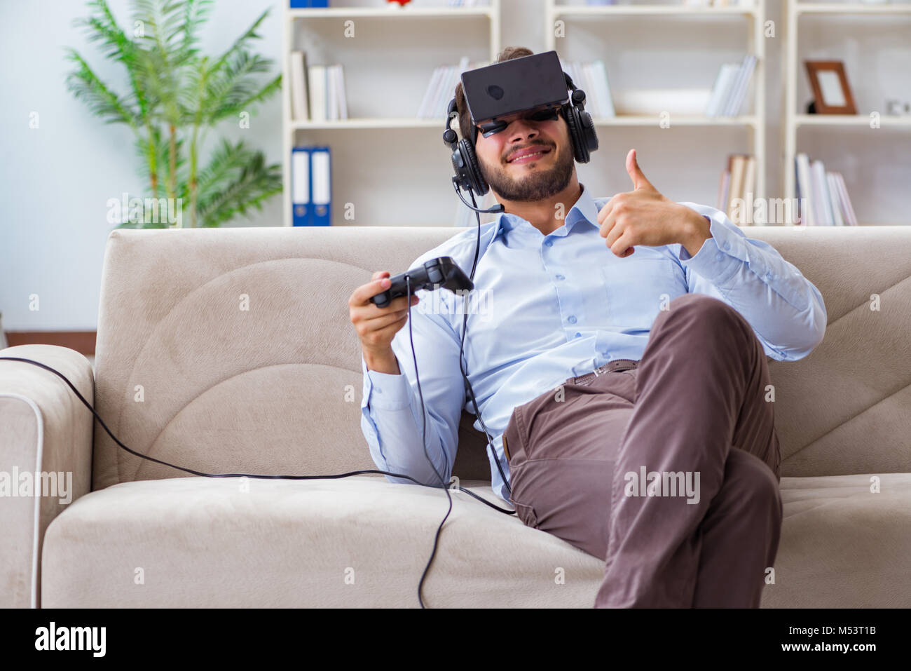 Student gamer playing games at home Stock Photo - Alamy