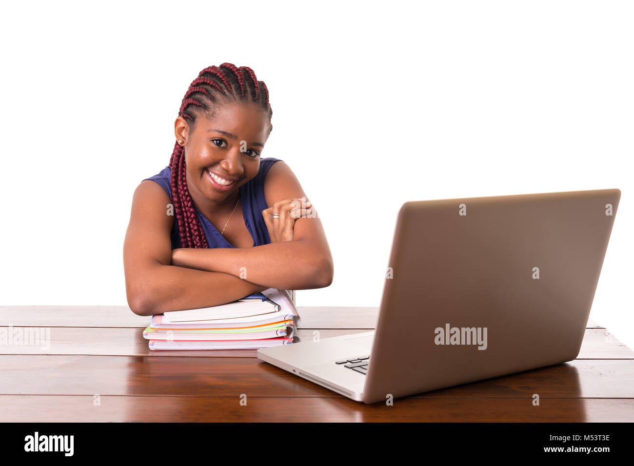 Young african student working with her laptop, isolated over a white ...