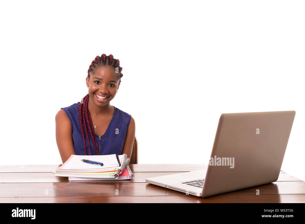 Young african student working with her laptop, isolated over a white ...