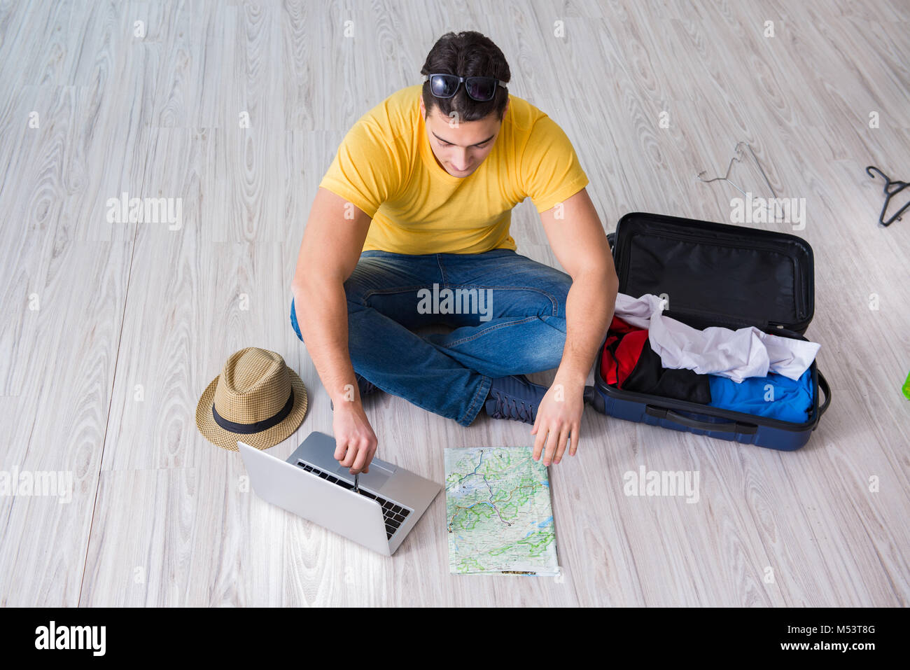 Man planning his vacation trip with map Stock Photo - Alamy