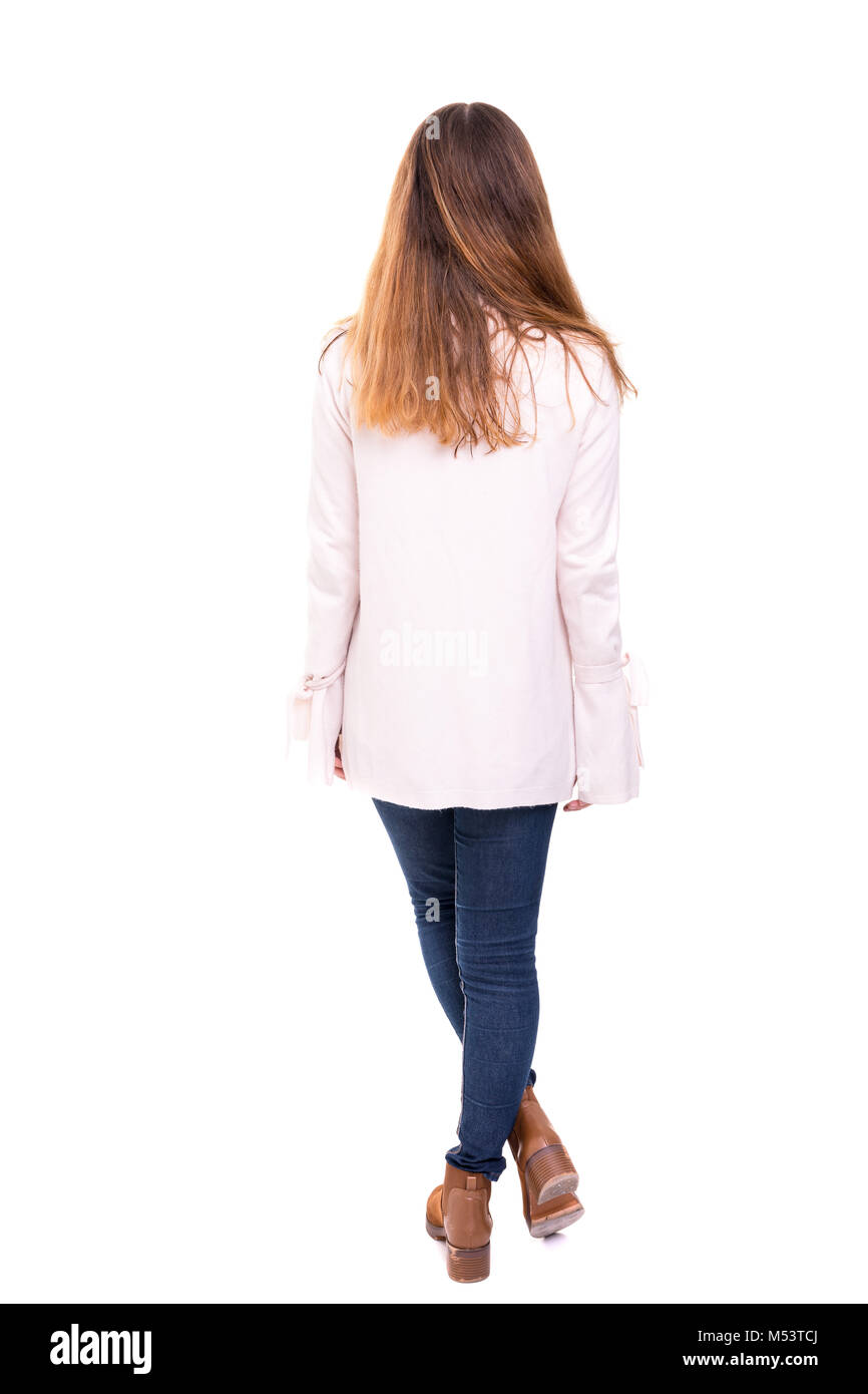 Woman posing with her back faced to camera, isolated over copy space ...