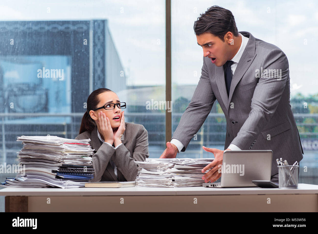 Boss yelling at his team member Stock Photo - Alamy