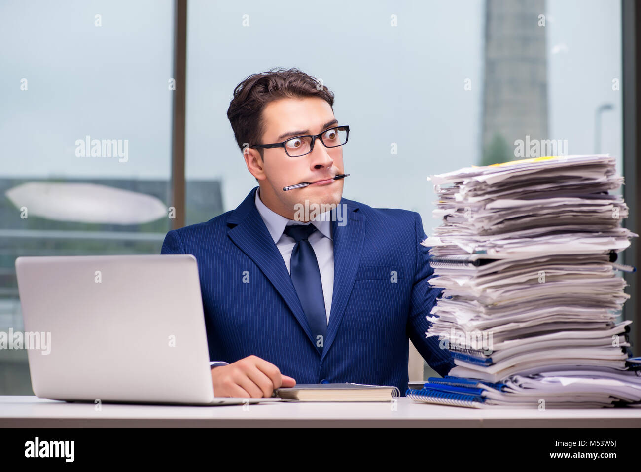 Workaholic businessman overworked with too much work in office Stock ...