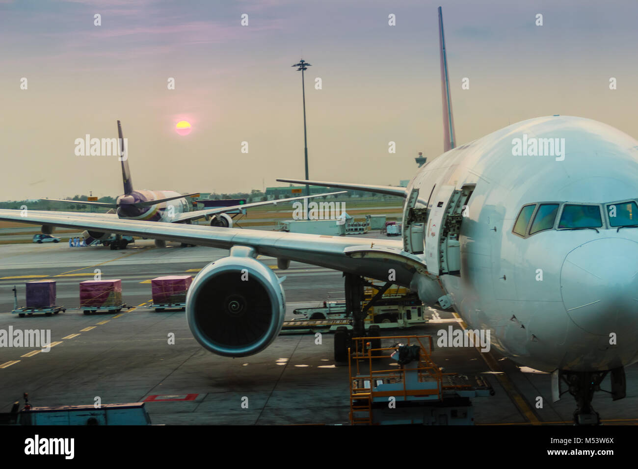 Airplane at the terminal gate ready for takeoff in modern international ...