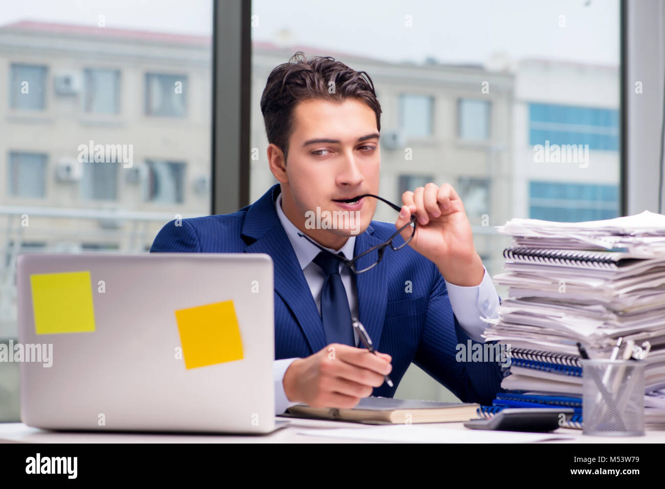 Workaholic businessman overworked with too much work in office Stock ...