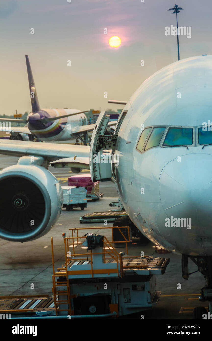 Airplane at the terminal gate ready for takeoff in modern international ...