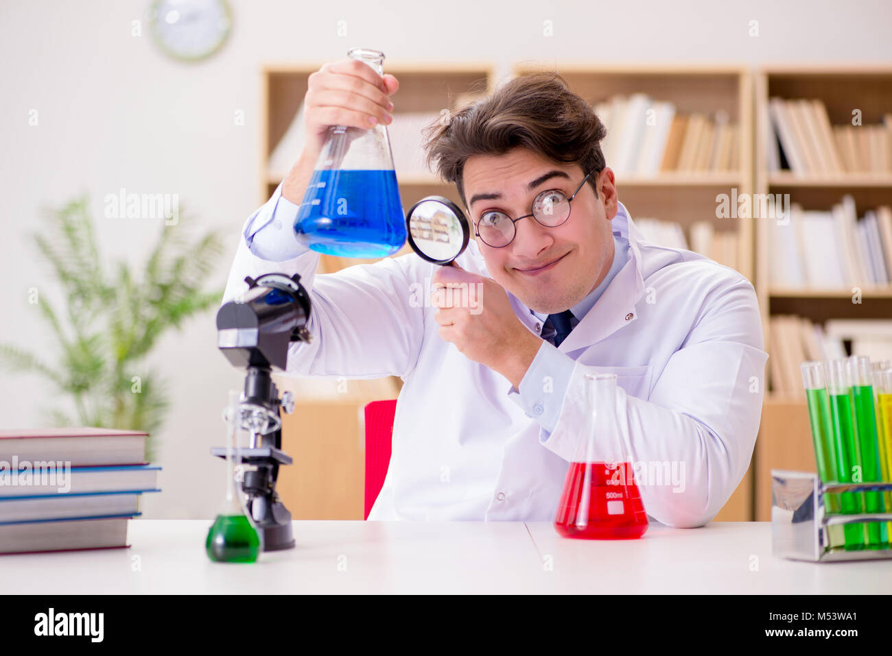 Mad crazy scientist doctor doing experiments in a laboratory Stock ...