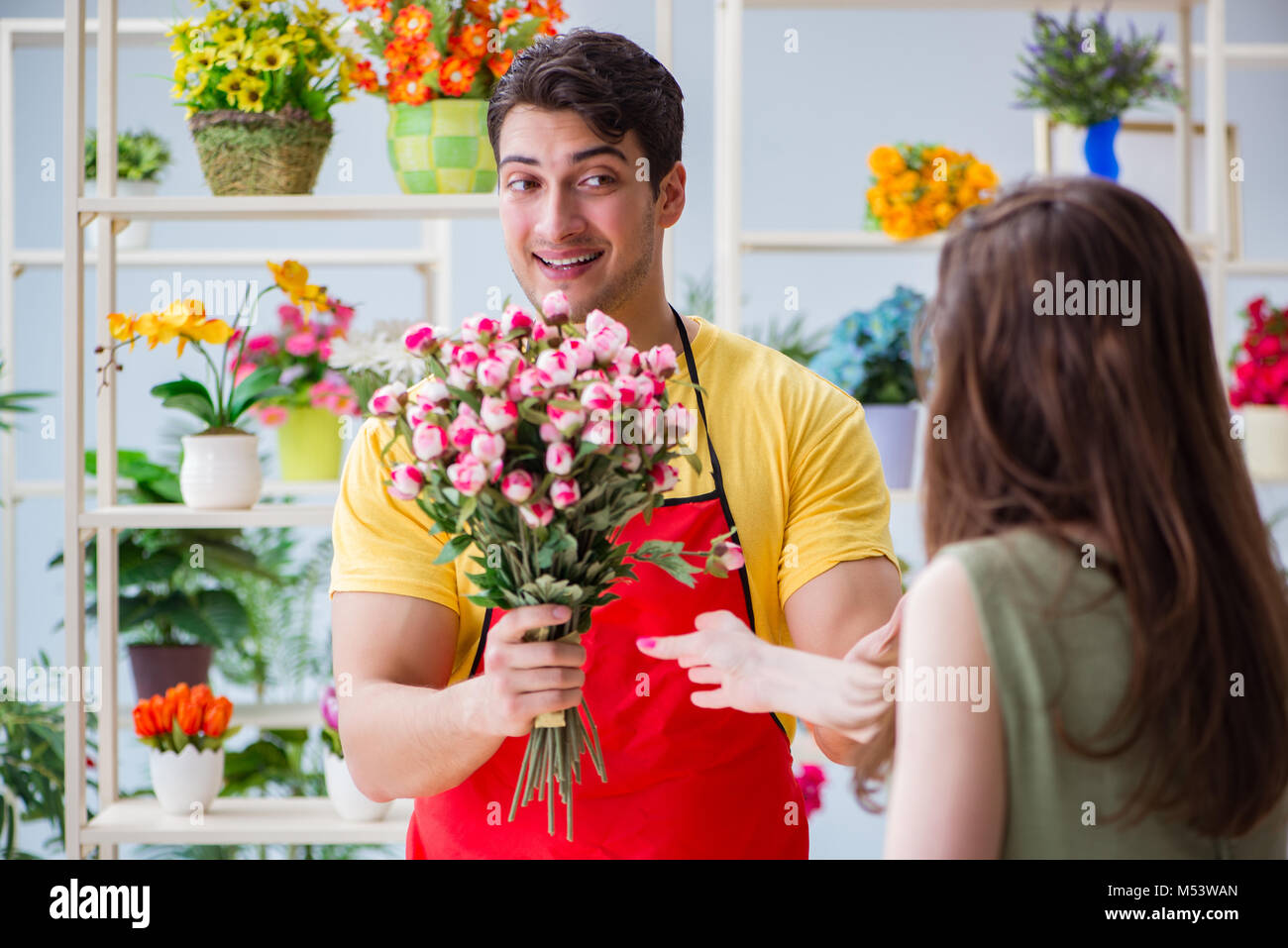 Florist selling flowers in a flower shop Stock Photo - Alamy