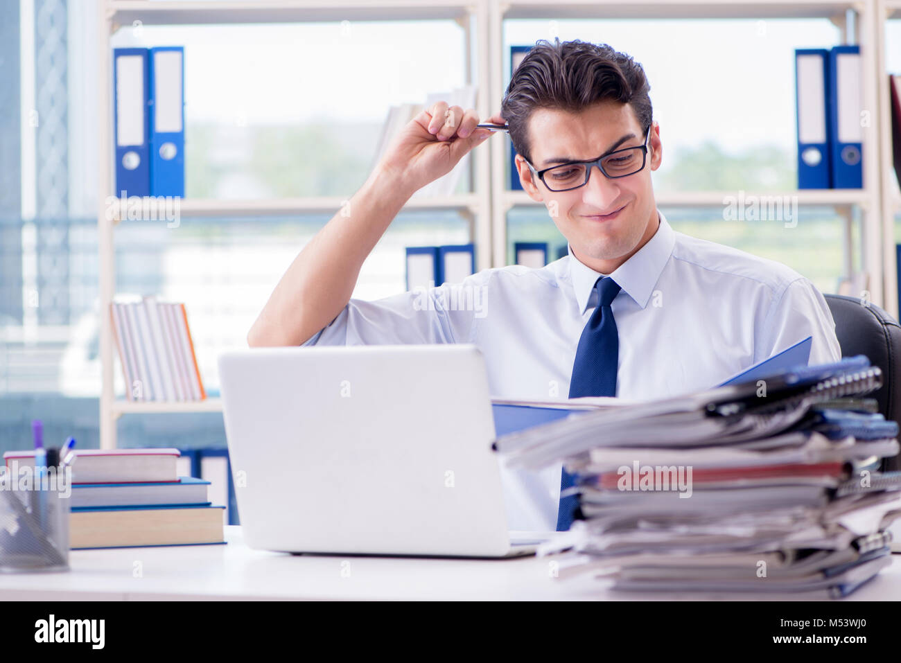 Businessman with excessive work paperwork working in office Stock Photo ...