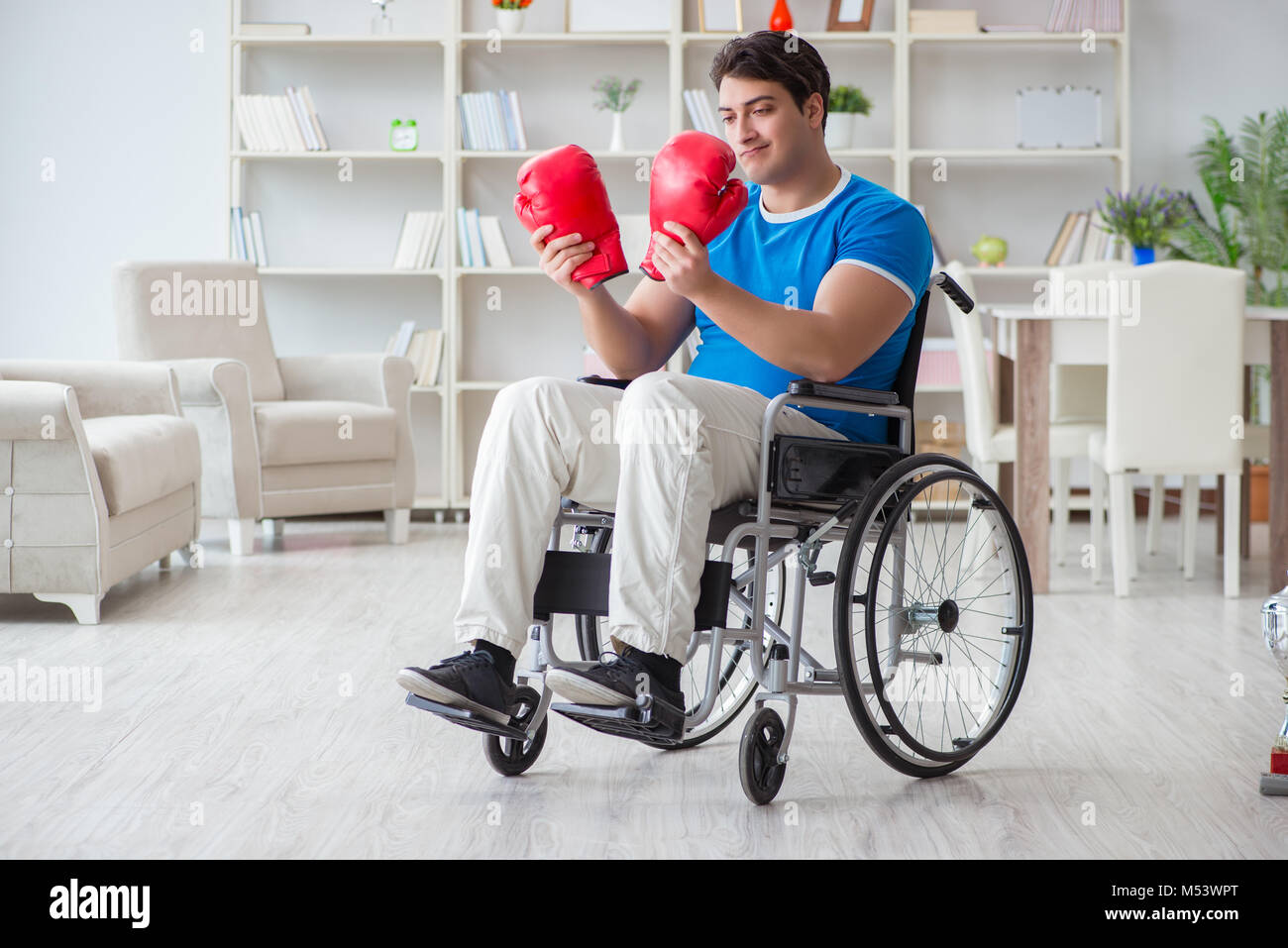 Disabled boxer at wheelchair recovering from injury Stock Photo - Alamy