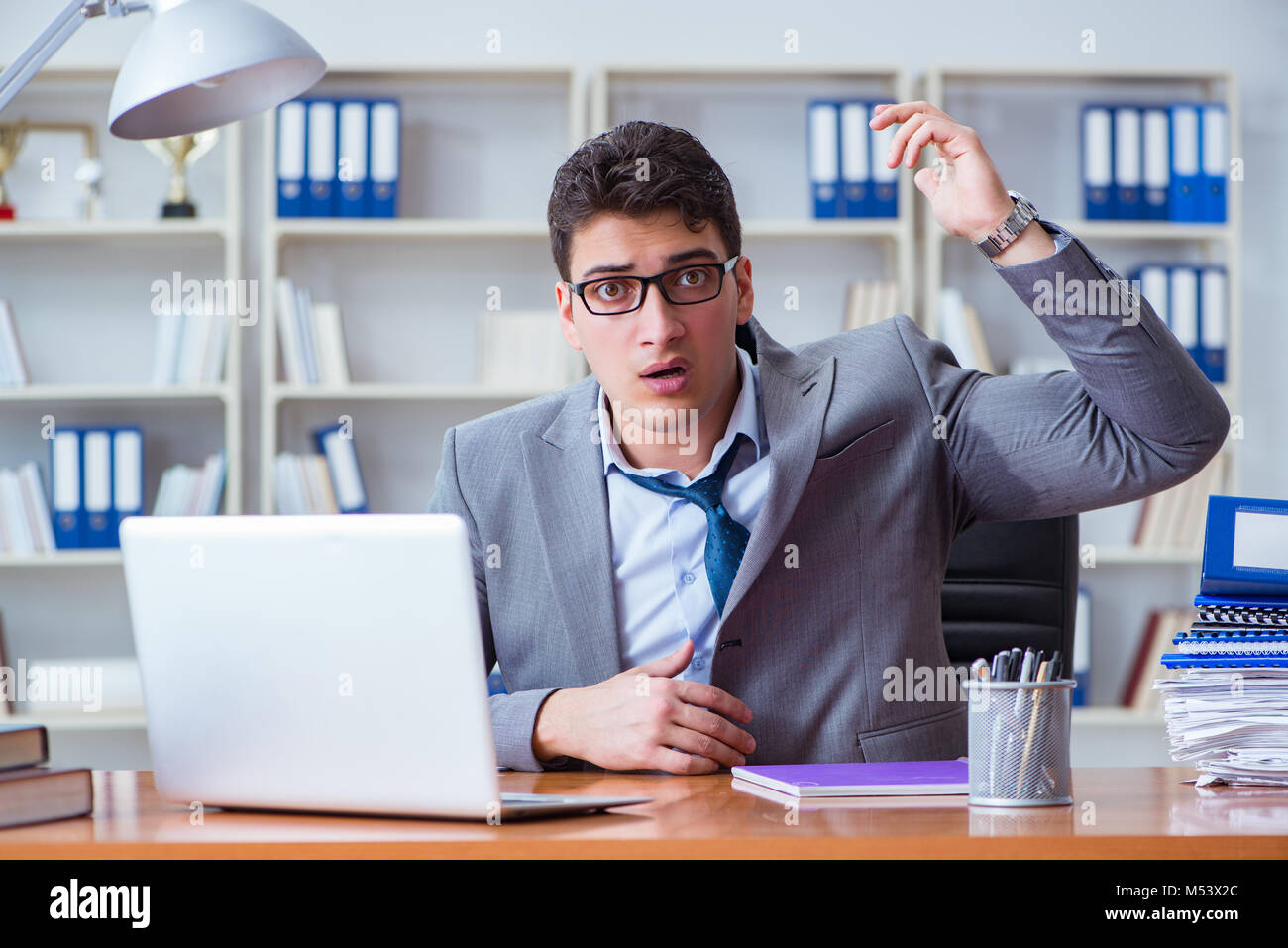 Businessman sweating excessively smelling bad in office at workp Stock ...