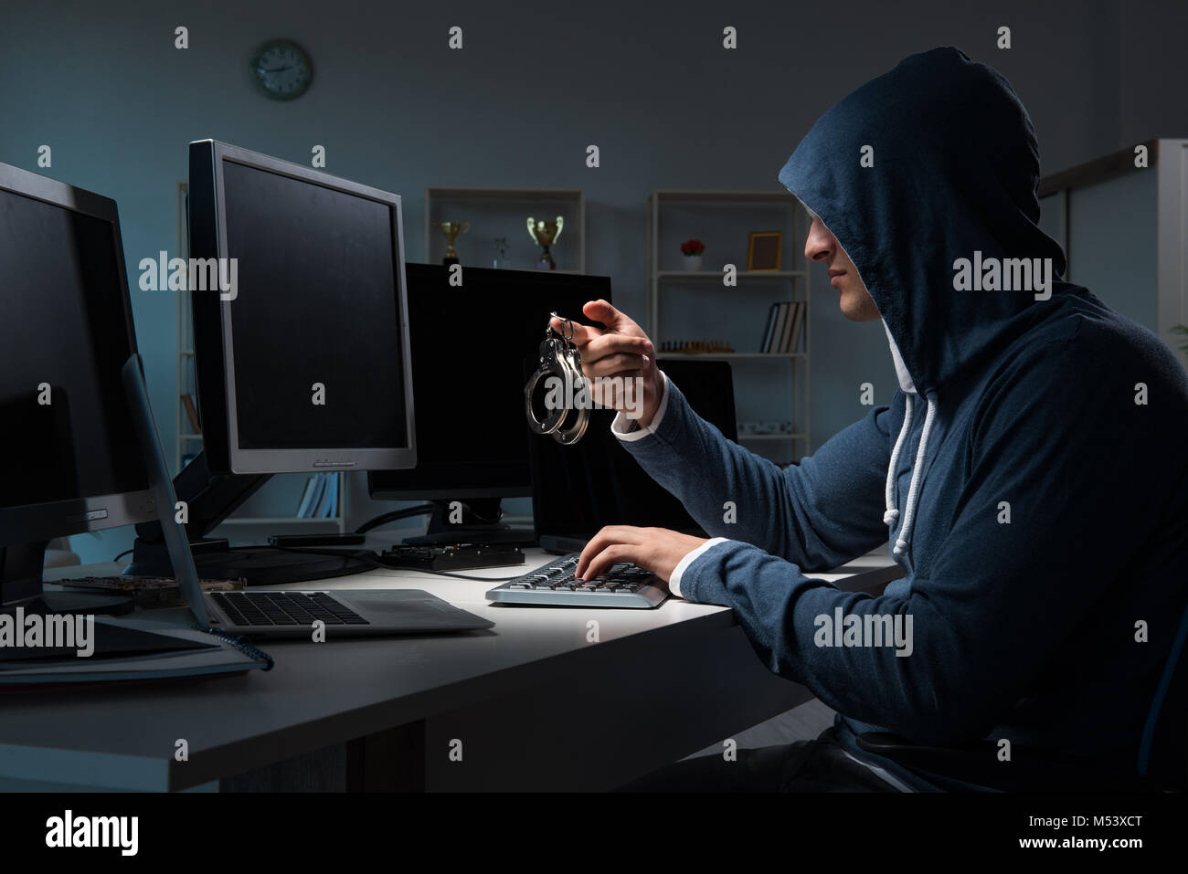 Hacker hacking computer at night Stock Photo - Alamy