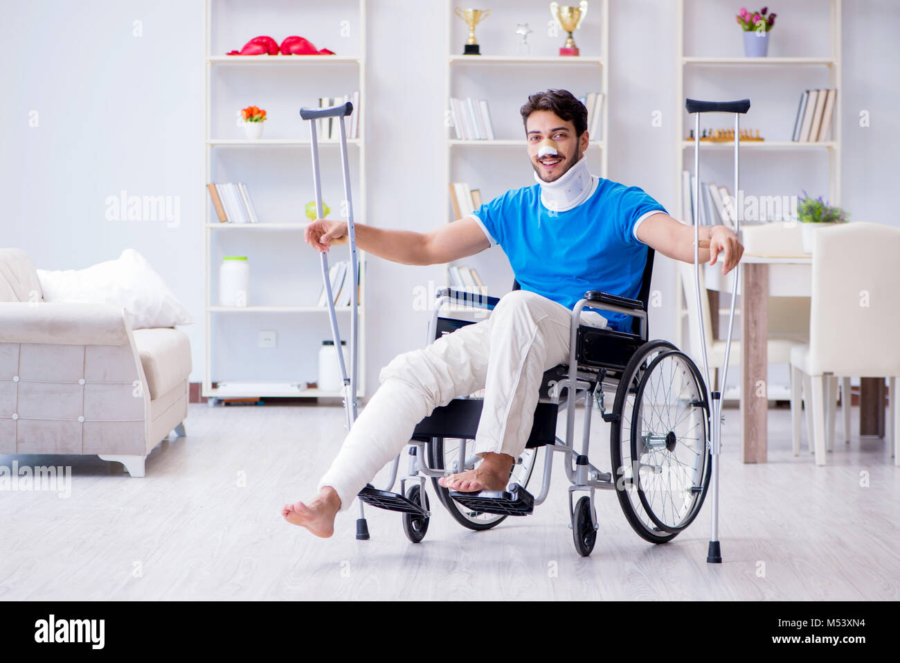 Injured young man recovering at home Stock Photo - Alamy