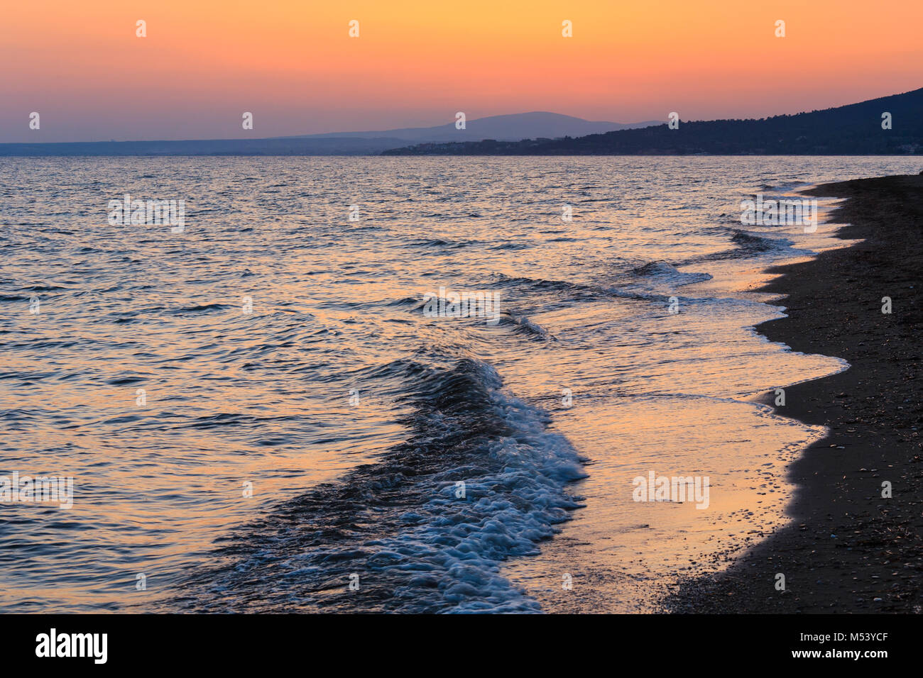 Sea sunset on beach, Greece Stock Photo - Alamy