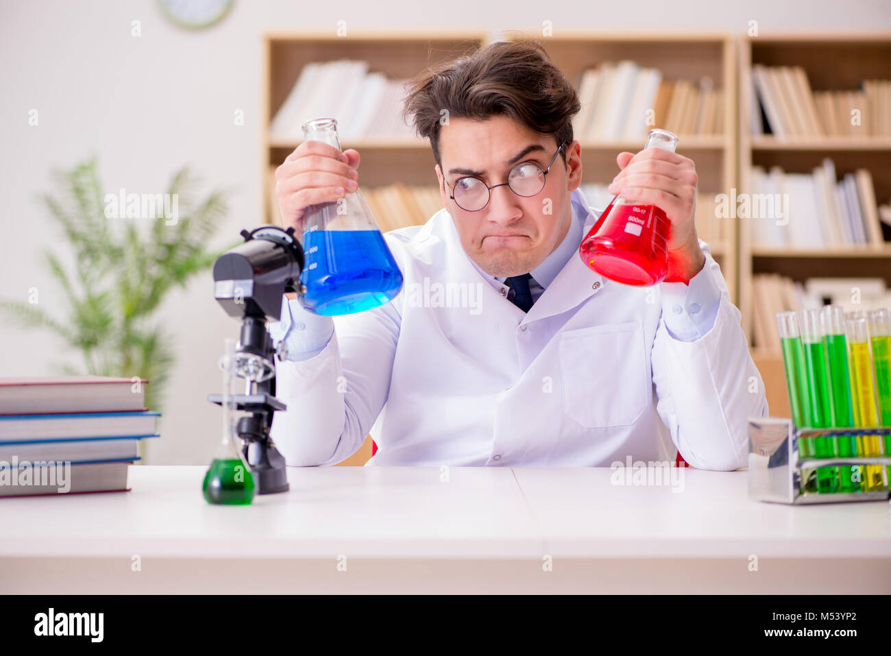Mad crazy scientist doctor doing experiments in a laboratory Stock ...
