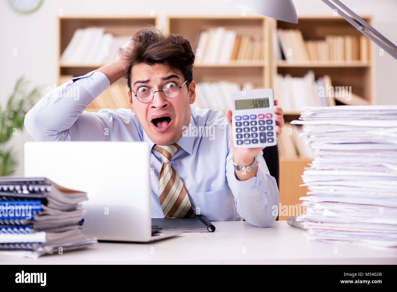 Funny accountant bookkeeper working in the office Stock Photo - Alamy