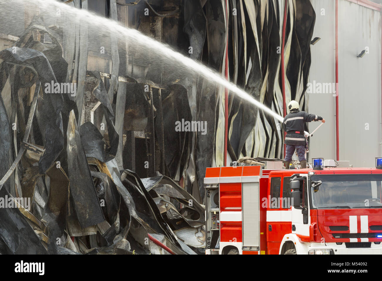 Large fire disaster in a warehouse Stock Photo - Alamy