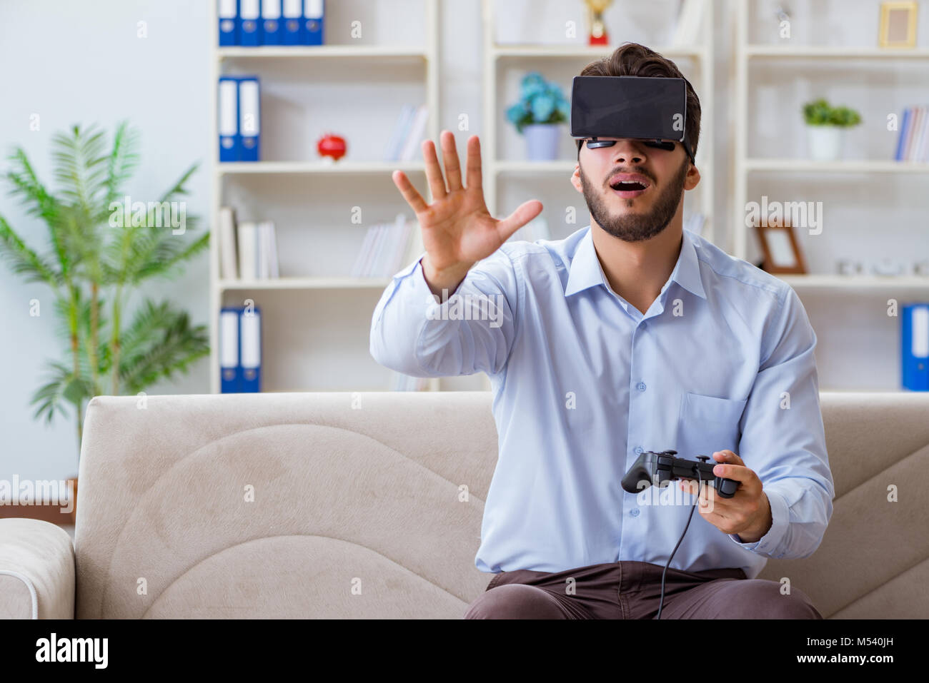 Student gamer playing games at home Stock Photo - Alamy