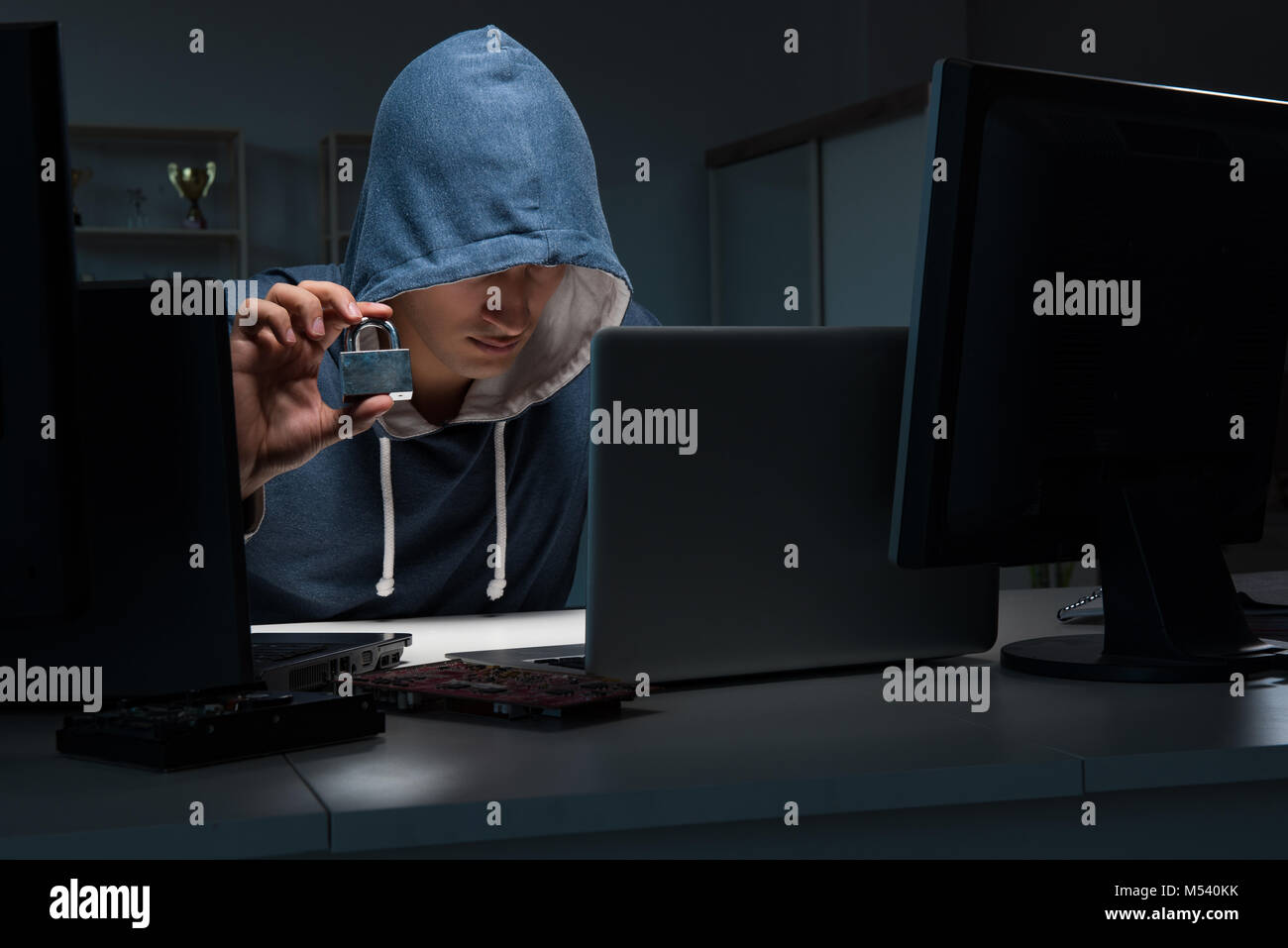 Hacker hacking computer at night Stock Photo - Alamy