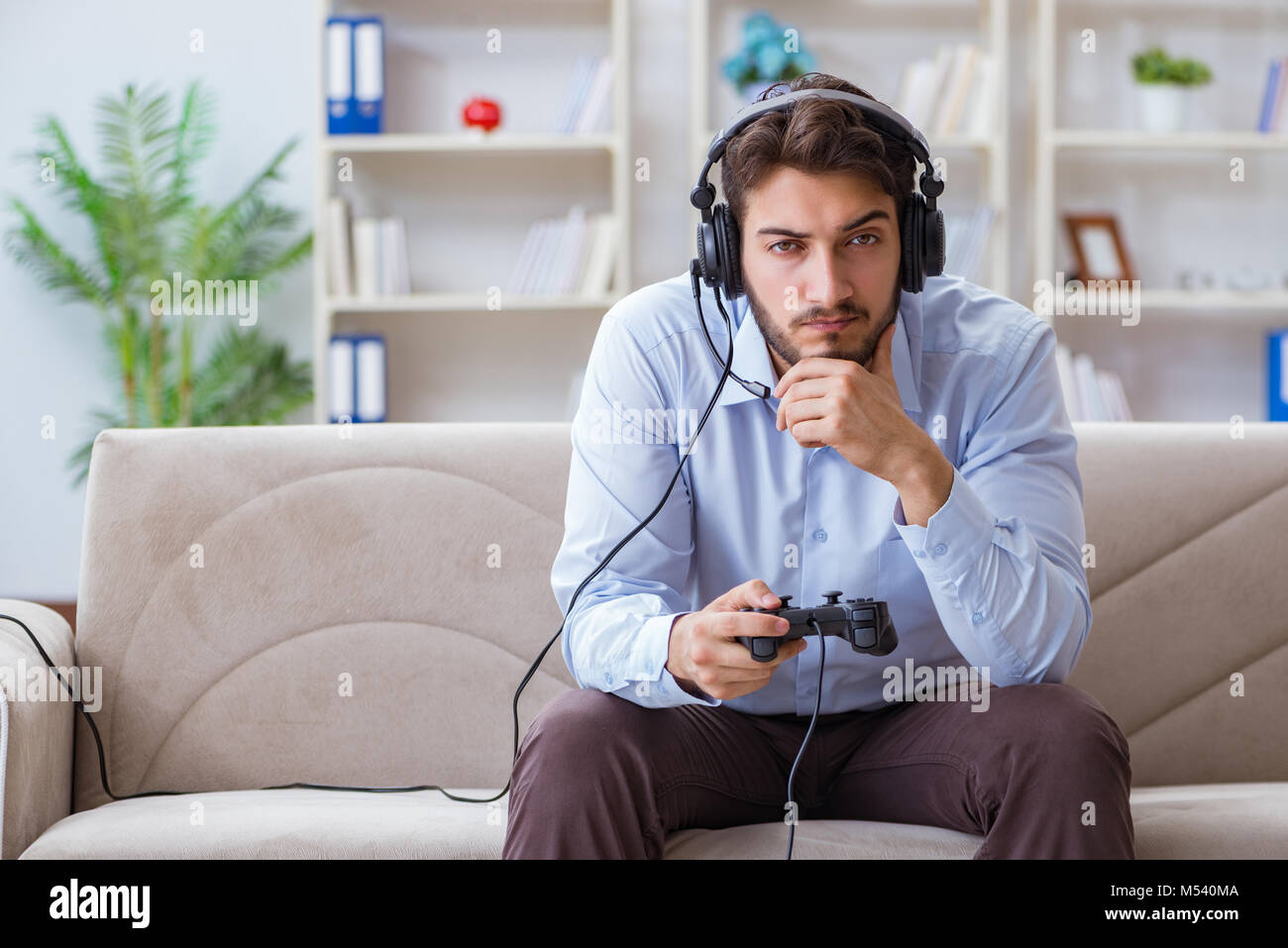 Student gamer playing games at home Stock Photo - Alamy