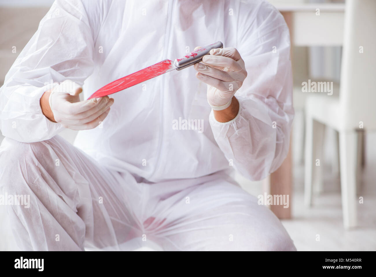 Forensic expert at crime scene doing investigation Stock Photo - Alamy