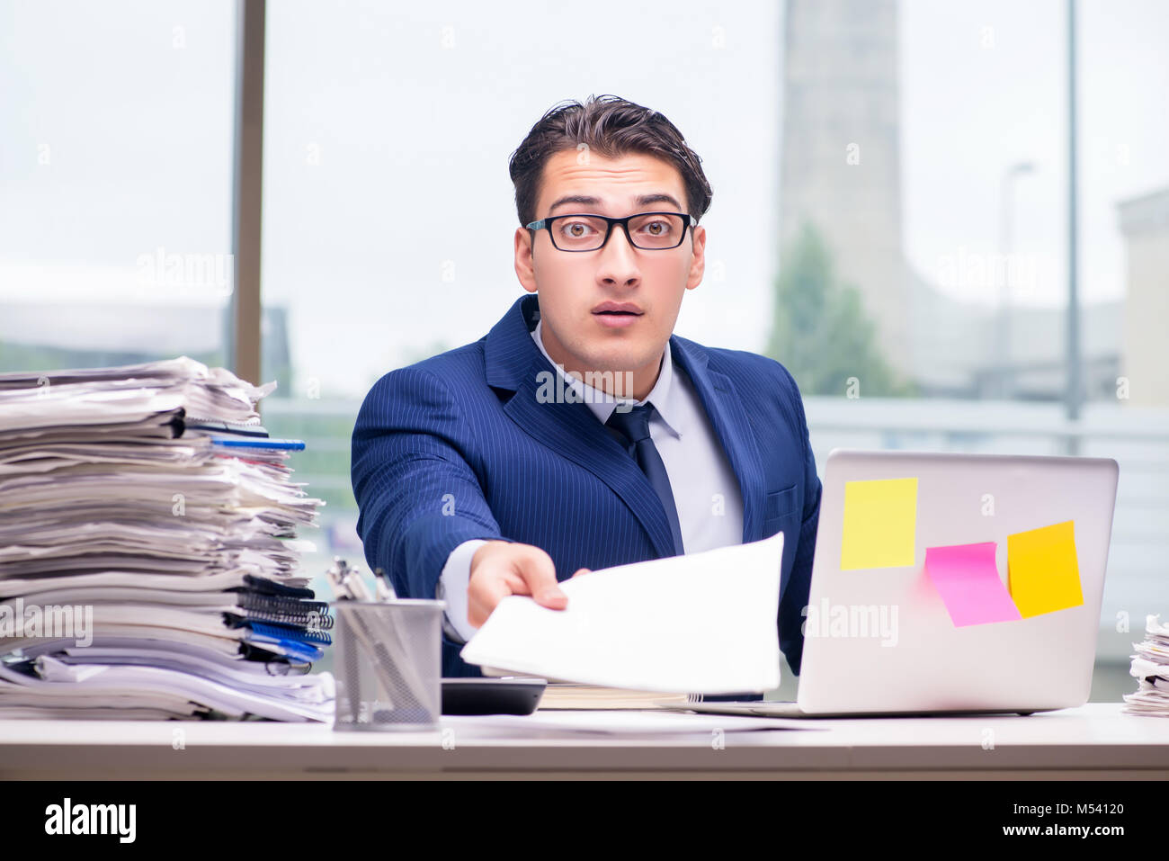 Workaholic businessman overworked with too much work in office Stock ...