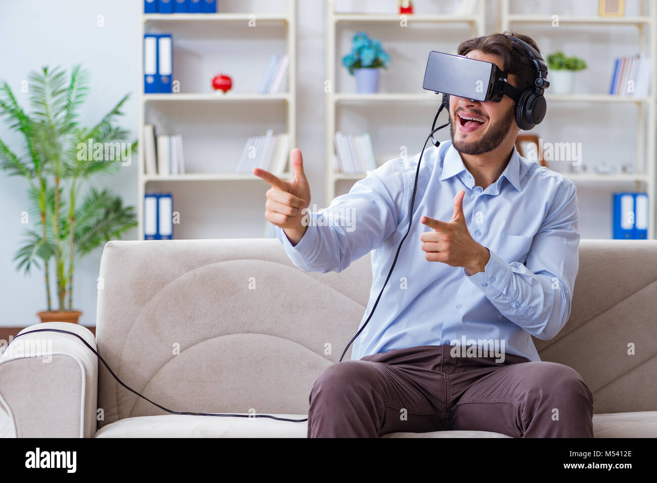Student gamer playing games at home Stock Photo - Alamy