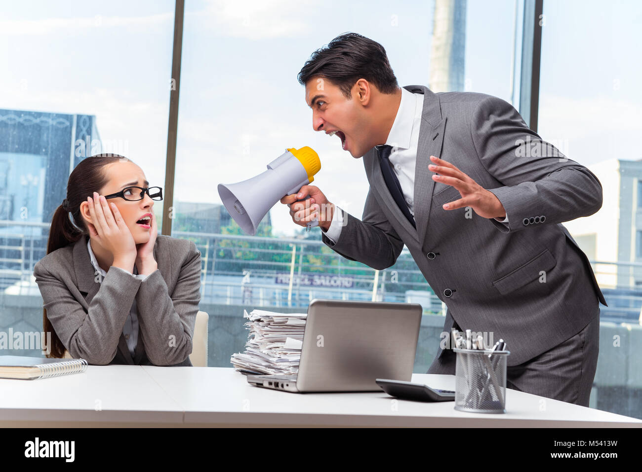 Boss yelling at his team member Stock Photo - Alamy